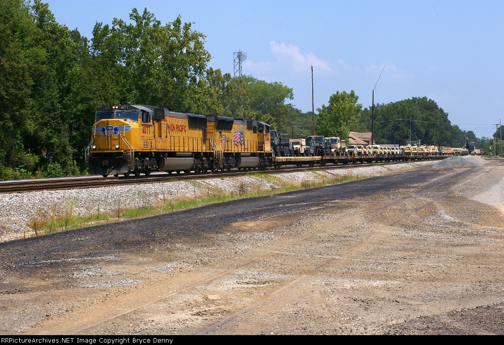 UP 4077 leading military train southbound on KCS